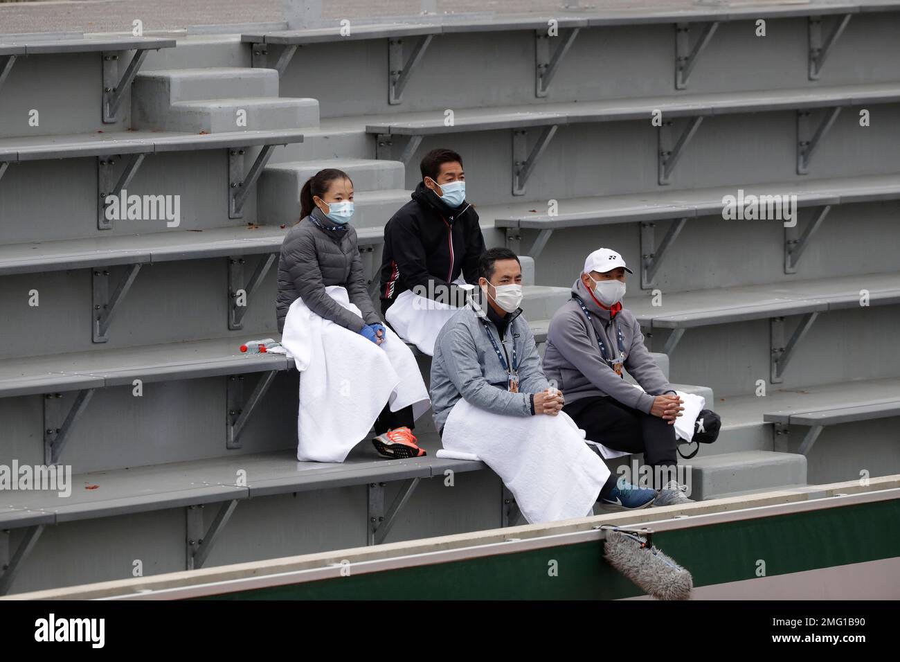 Four spectators watch Japan's Kei Nishikori play his first round match ...