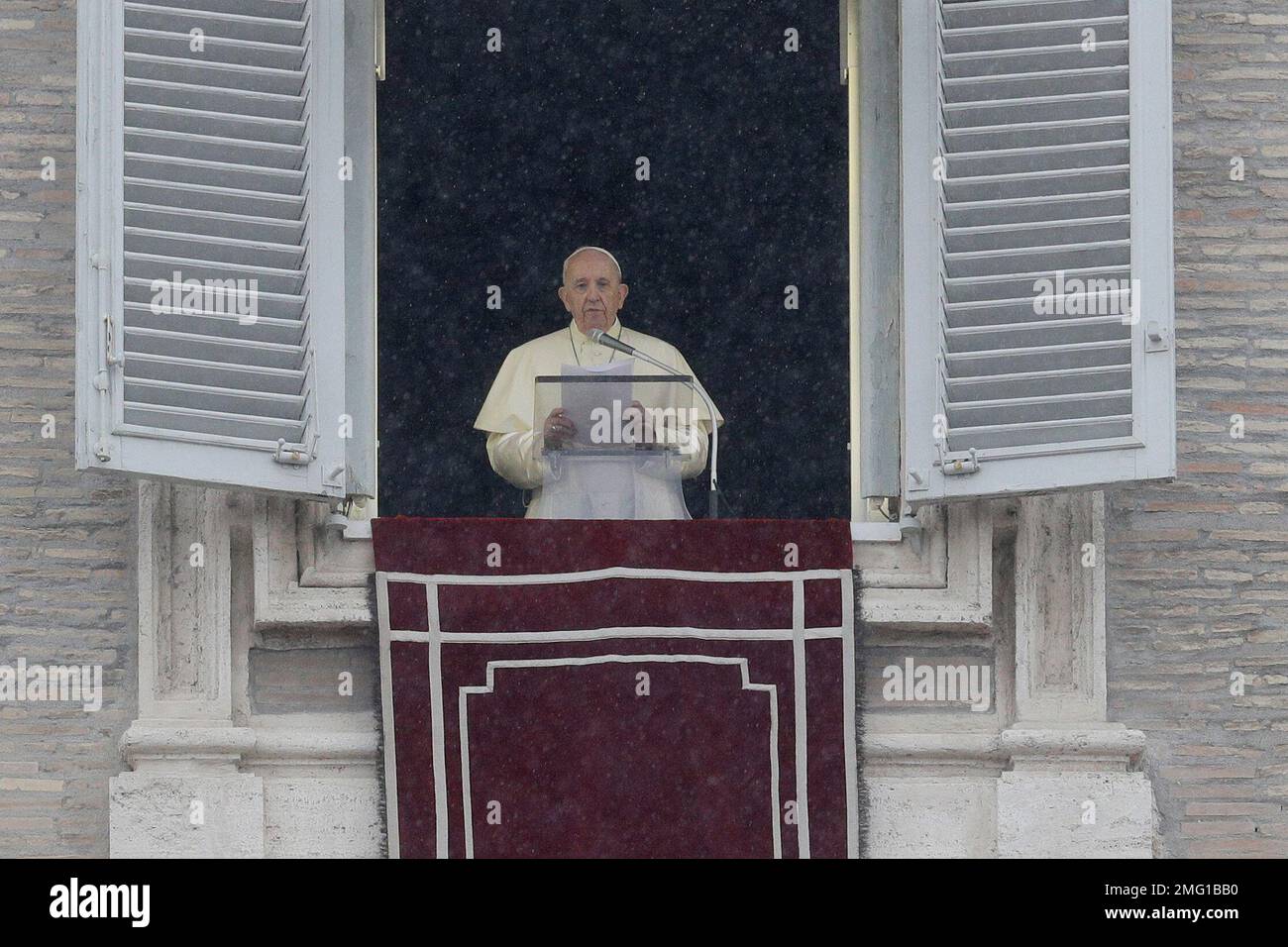 Pope Francis recites the Angelus noon prayer from his studio's window ...