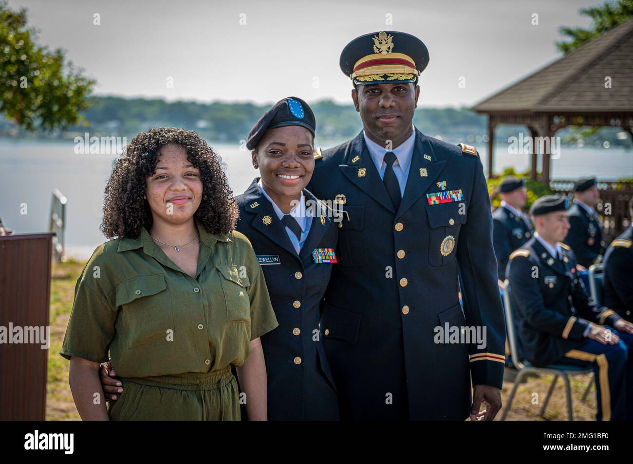 Second Lieutenant Rhecia Llewellyn, center, poses for a photo with ...
