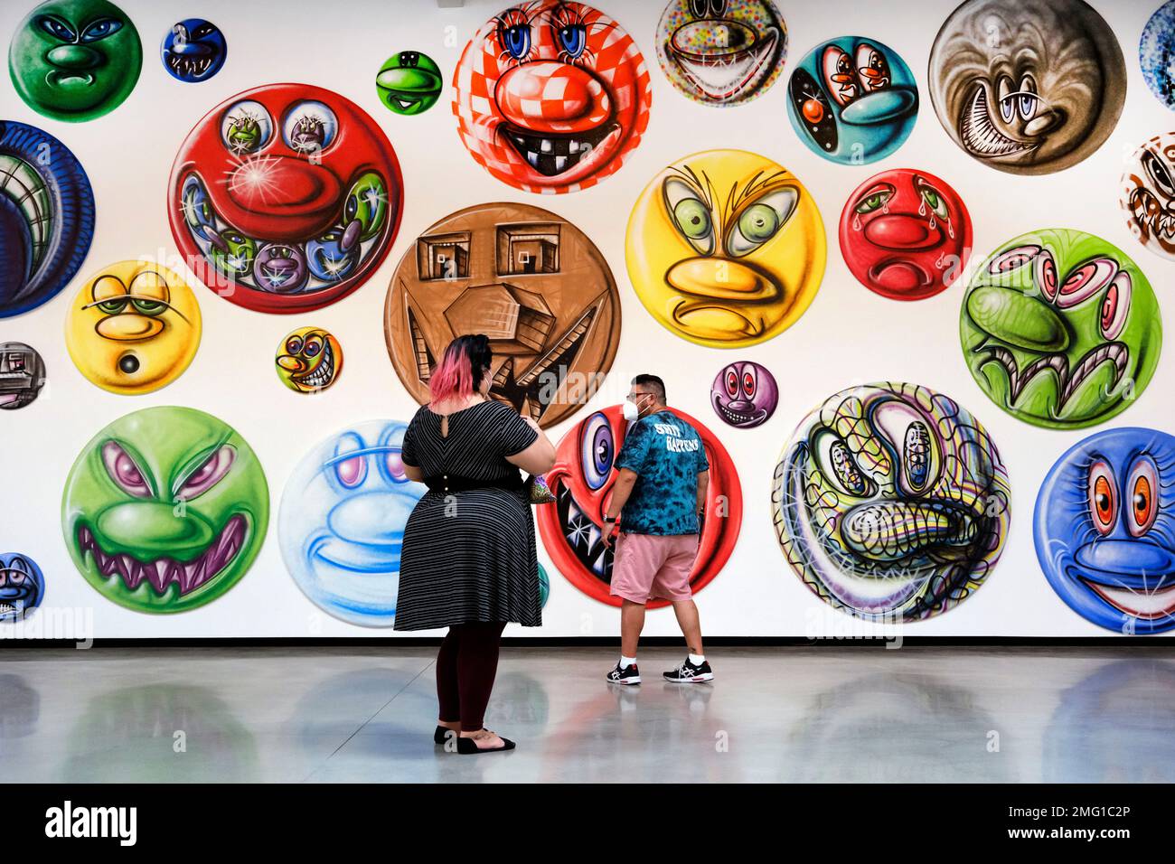 Visitors view an exhibition entitled, "MOODZ," the art of Kenny Scharf ...