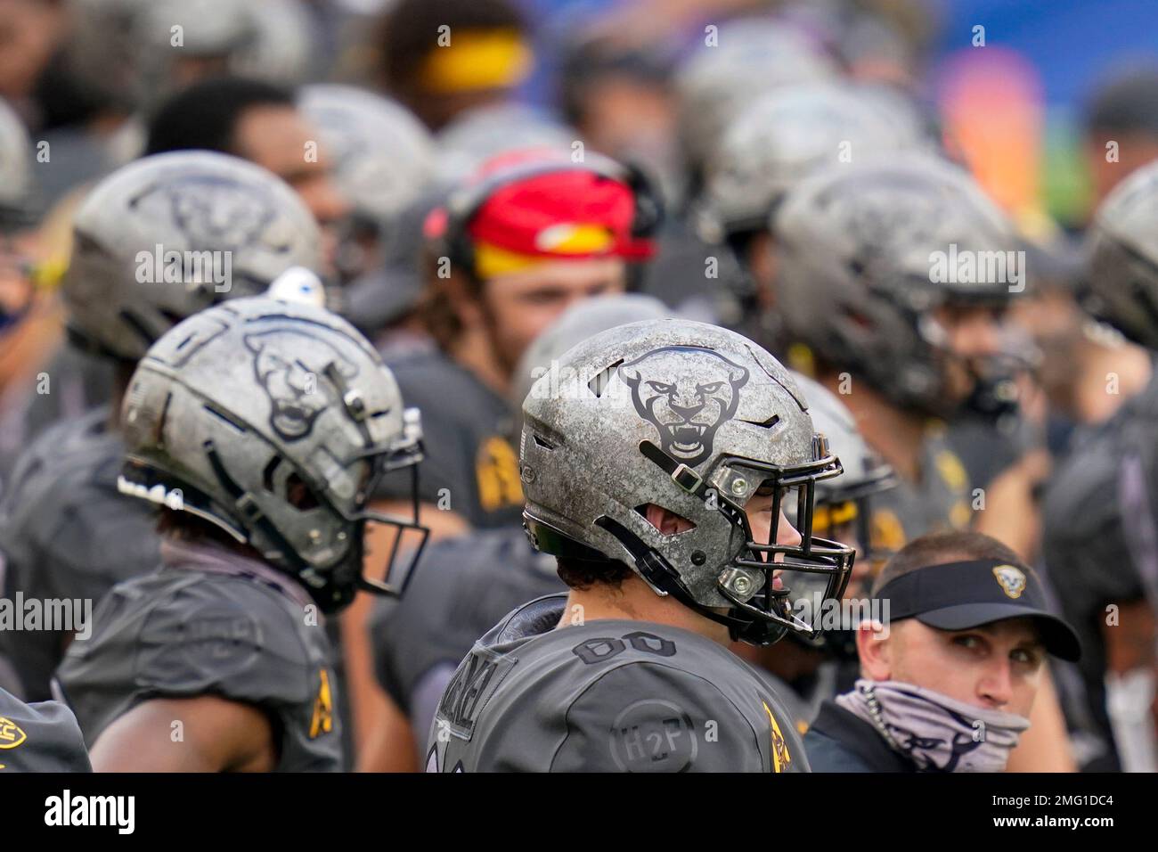 The Panther logo is visible on the Pittsburgh gray football helmets as ...