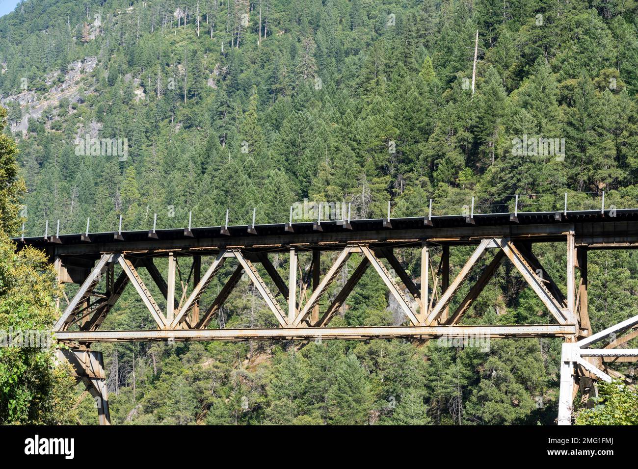 Close up view of the Merlin Railroad Bridge with the mountains in ...