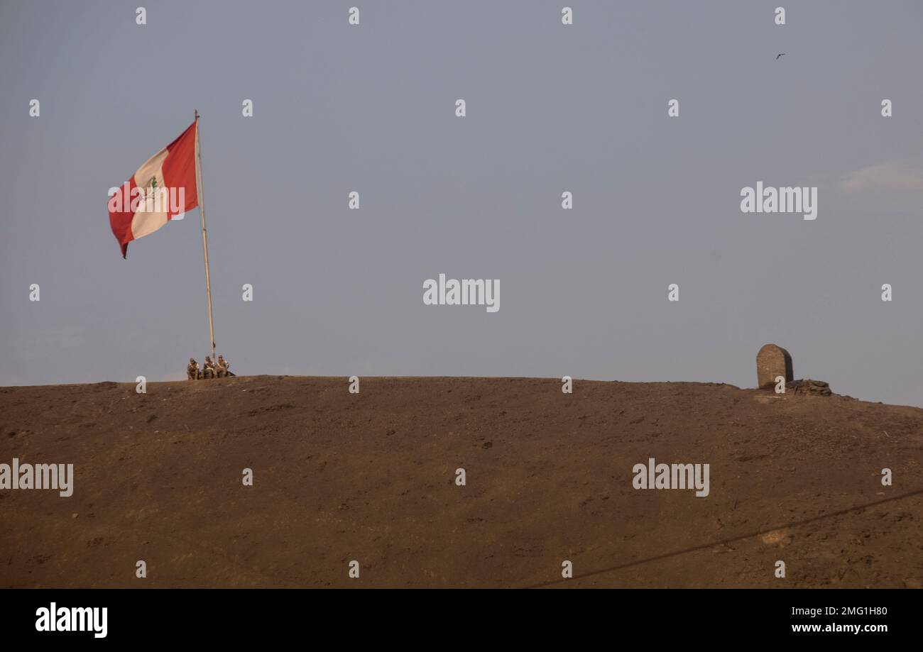 Soldiers rest under a Peruvian flag inside a military regiment, in Lima ...