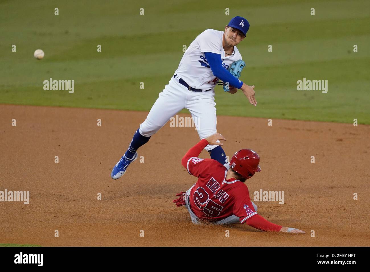 Los Angeles Angels' Jared Walsh slides after being forced out, while ...