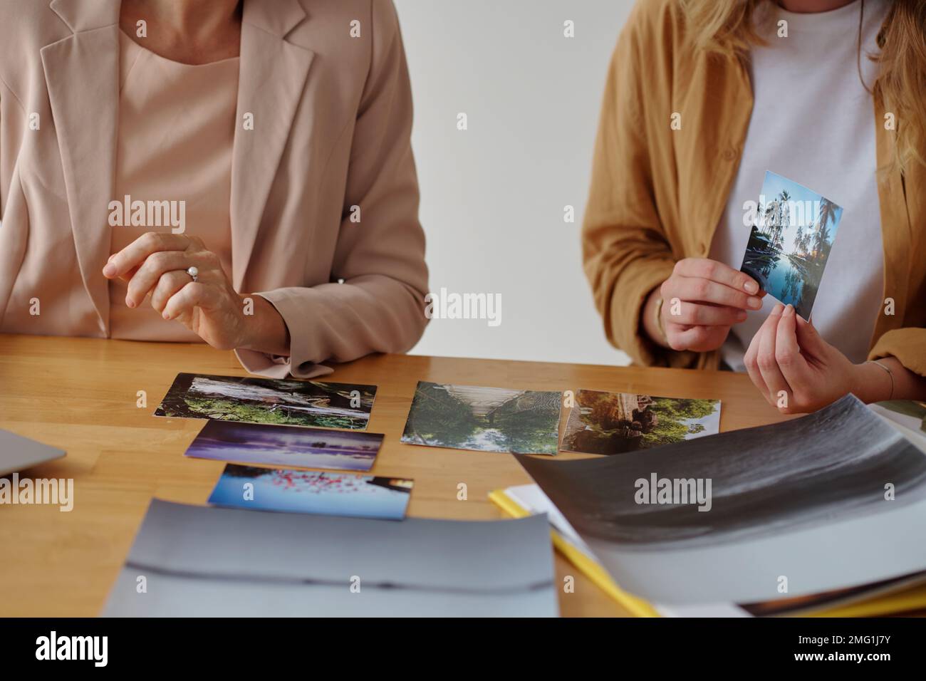 Art gallery managers selecting works for new exhibition Stock Photo - Alamy