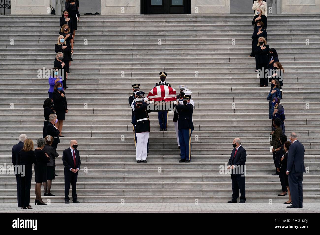 The flag-draped casket of Justice Ruth Bader Ginsburg is carried out by ...