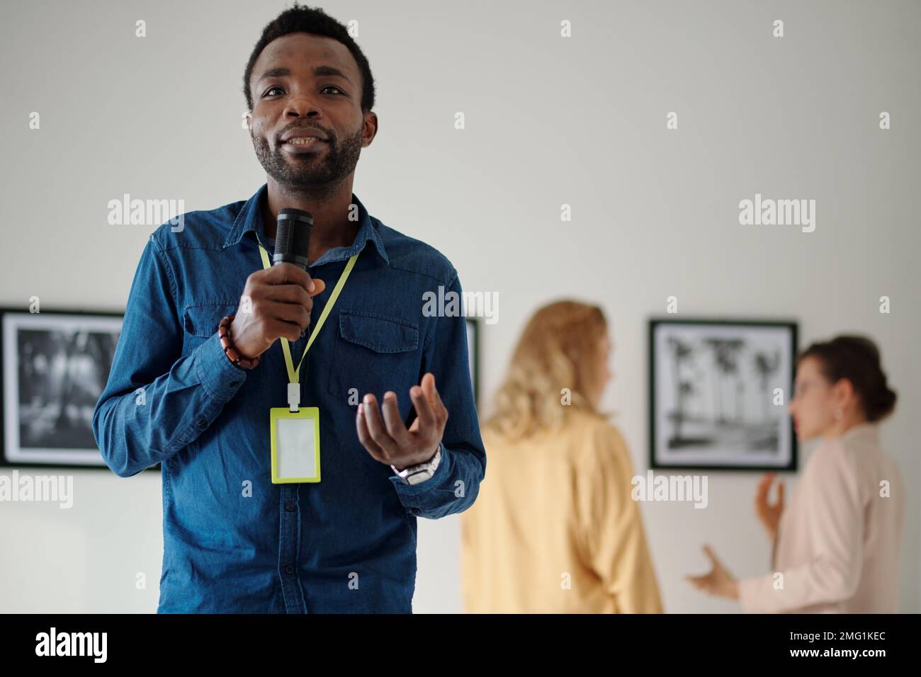 Journalist covering new exhibition in local art gallery Stock Photo - Alamy