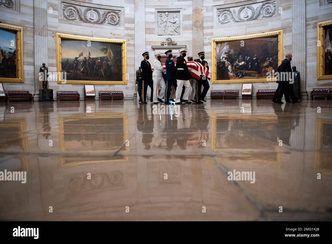 The flag-draped casket of Justice Ruth Bader Ginsburg is carried ...