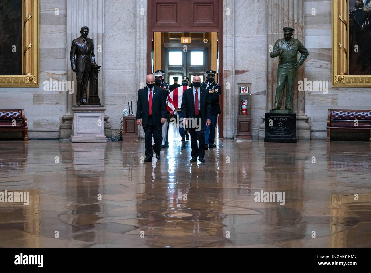 The flag-draped casket of Justice Ruth Bader Ginsburg is carried ...