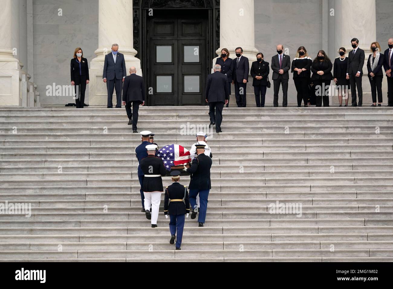 The flag-draped casket of Justice Ruth Bader Ginsburg is carried by a ...