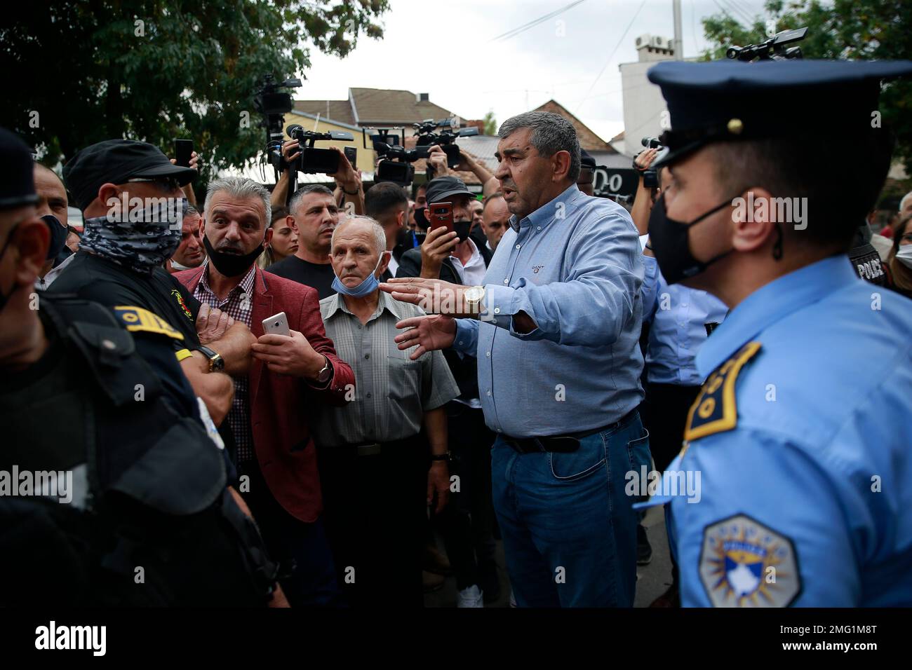 War veterans react with police after Hysni Gucati head of the War Veterans Organization of the ...