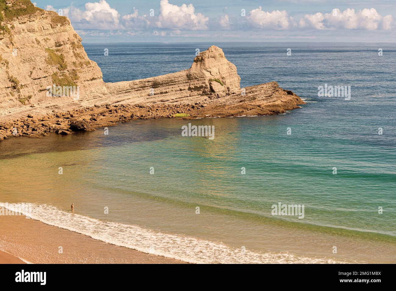 aerial view of Langre beach with natural rock breakwater cliff reef ...