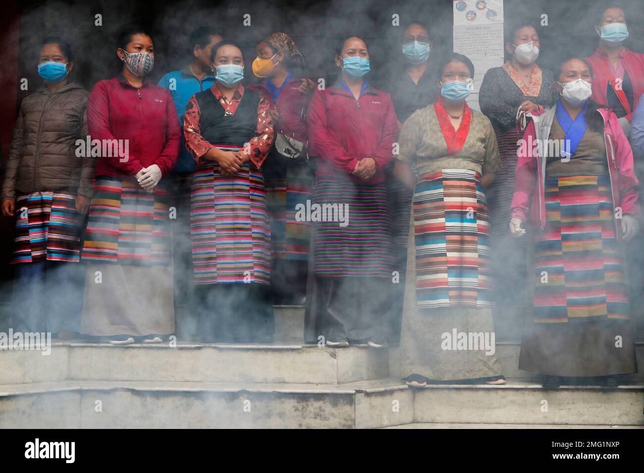 Friends and family members gather for the funeral of veteran Nepalese ...
