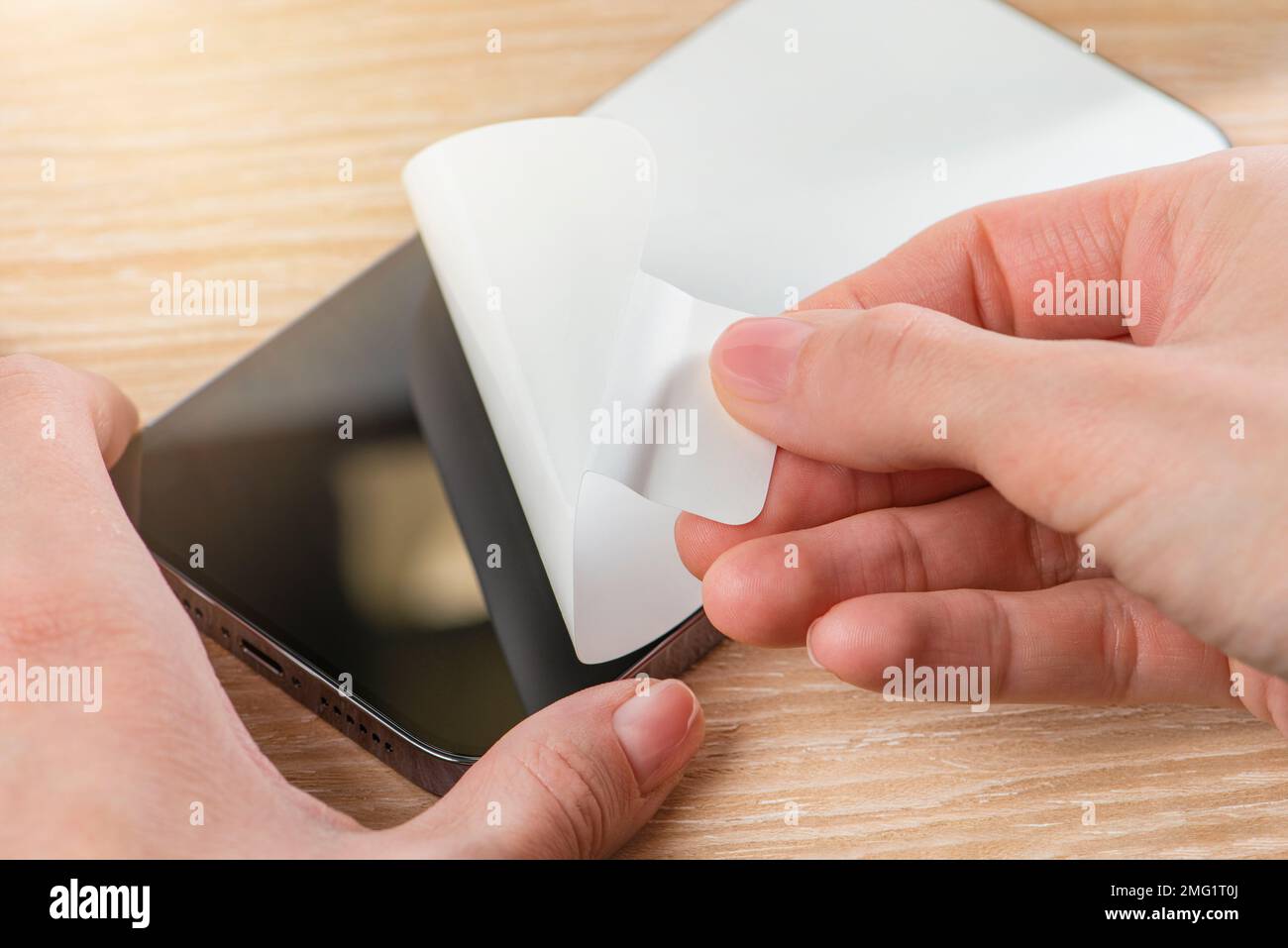 Unpacking a new phone. Remove the protective white film from the new ...