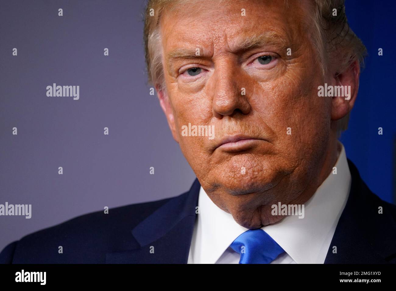 President Donald Trump listens during a news conference in the James ...