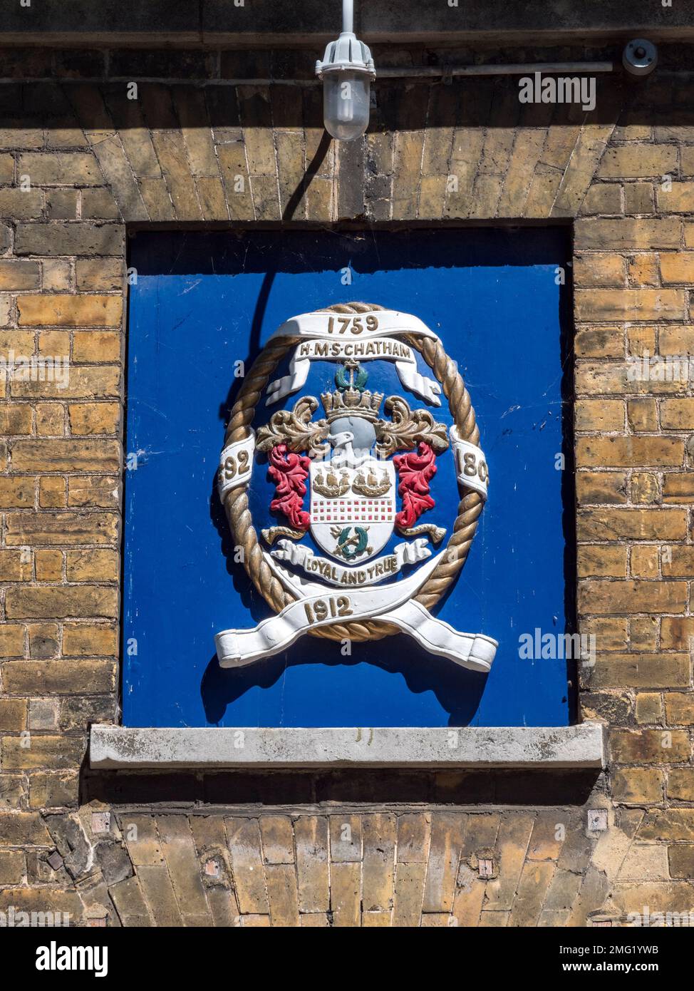 HMS Chatham emblem above the entrance door to the Admiral's Offices ...