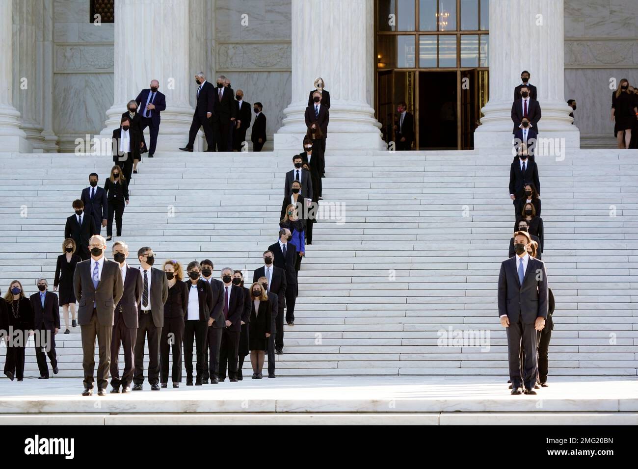 Former law clerks walk out and stand for the casket of Justice Ruth ...
