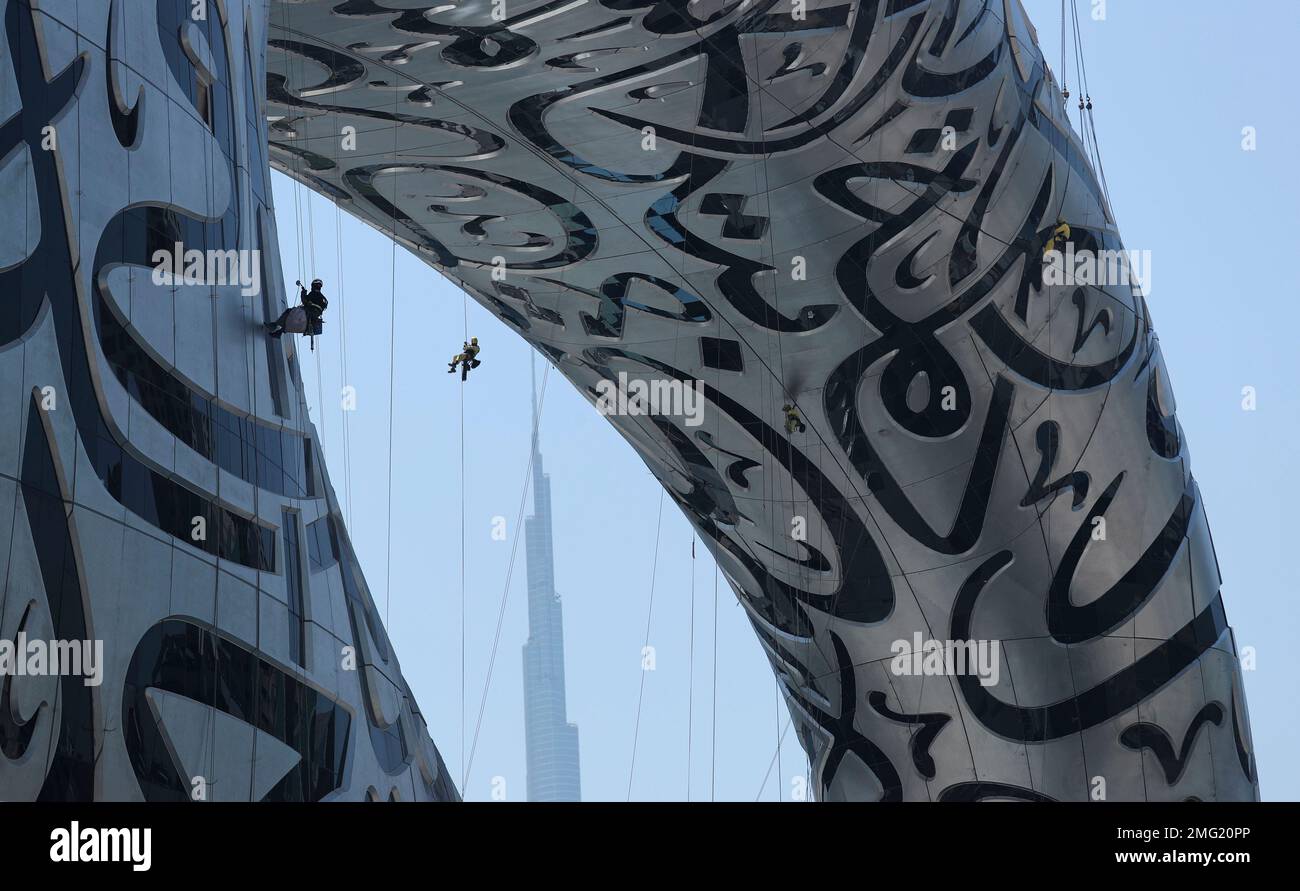 With the Burj Khalifa, the world's tallest building in the background ...