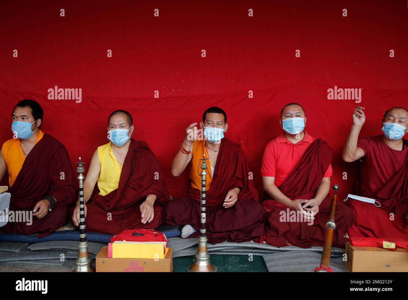 Buddhist monks perform rituals during the funeral of veteran Nepalese ...