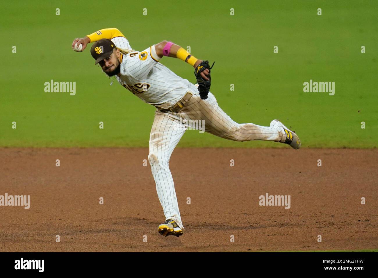 San Diego Padres shortstop Fernando Tatis Jr. throws to first too late ...