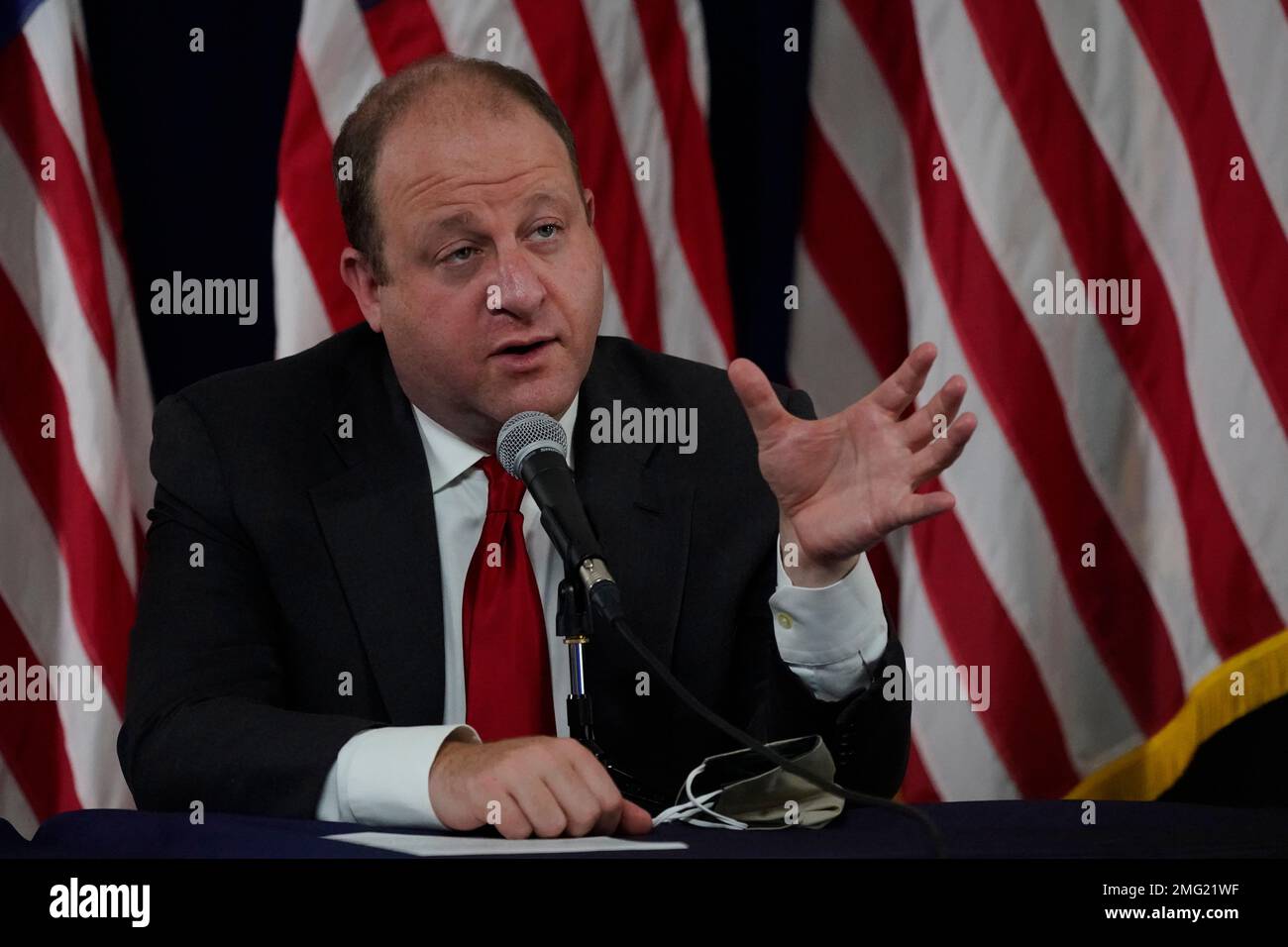 Colorado Governor Jared Polis makes a point about the increase in the ...