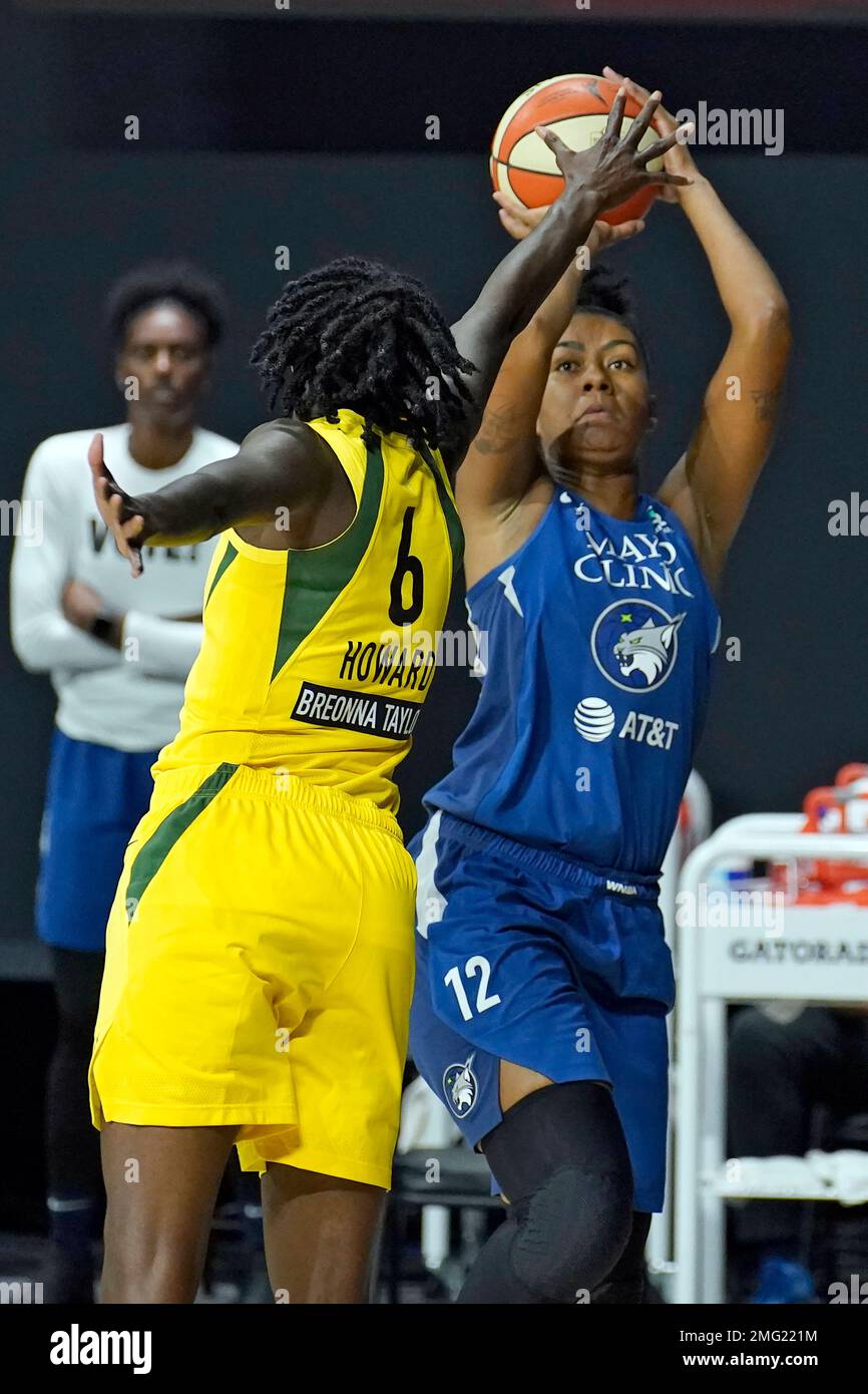 Minnesota Lynx forward Damiris Dantas (12) shoots over Seattle Storm ...