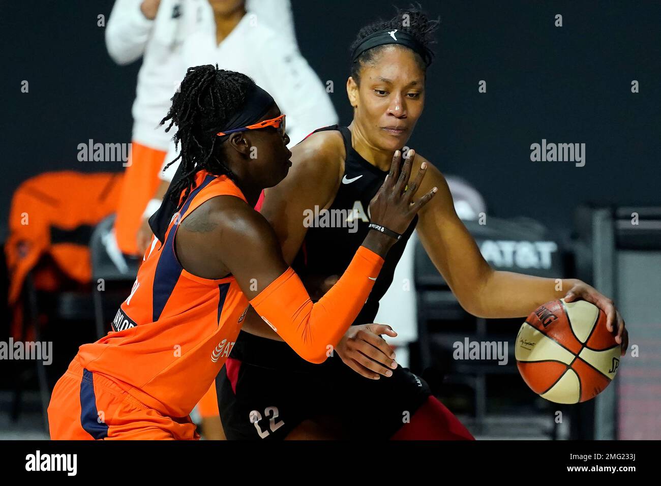 Las Vegas Aces center A'ja Wilson (22) drives around Connecticut Sun ...