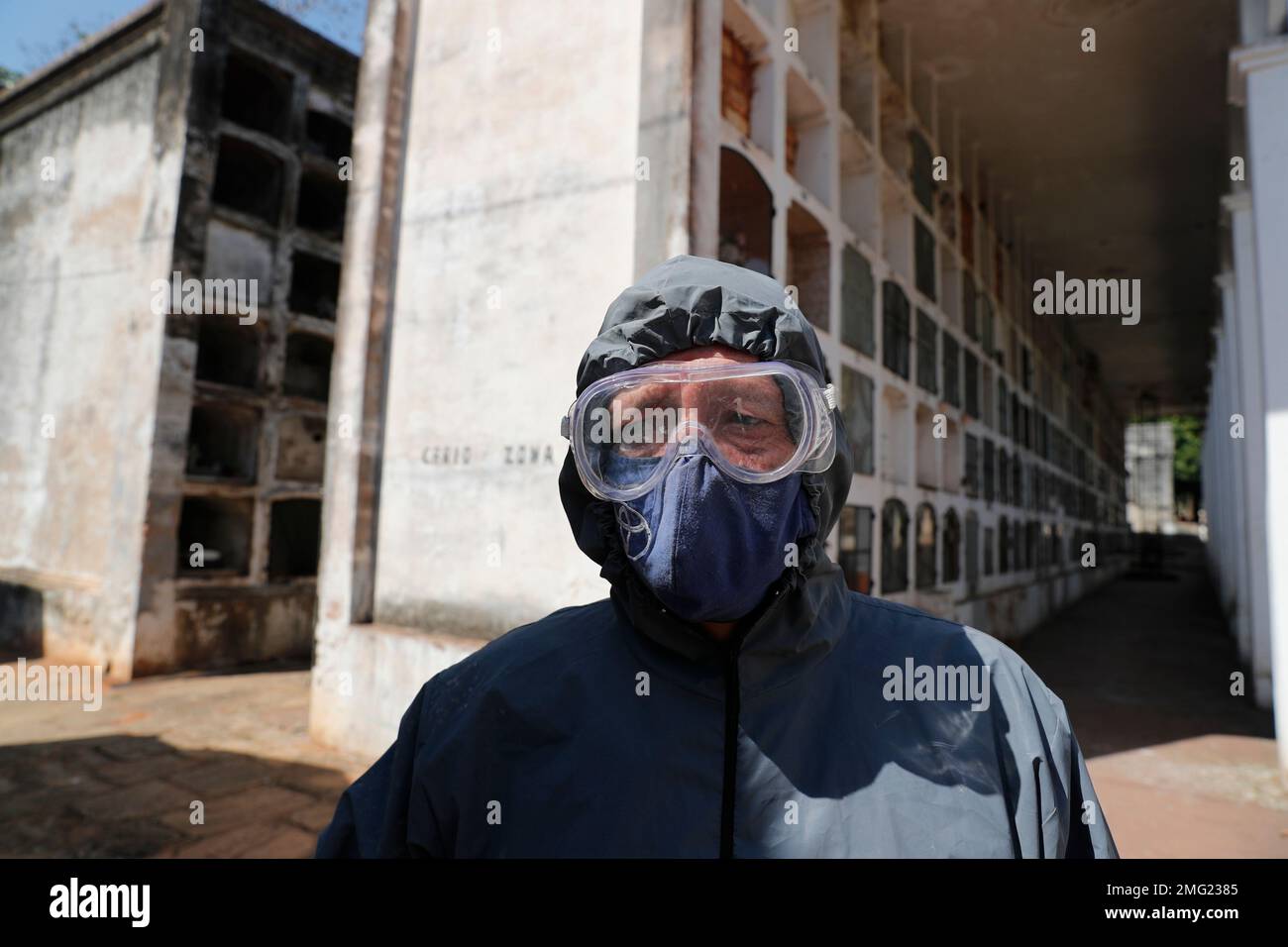 Undertaker Sergio Denis waits for the body of a person that died from ...