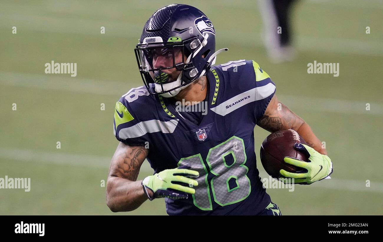Seattle Seahawks wide receiver Freddie Swain runs for a touchdown after ...