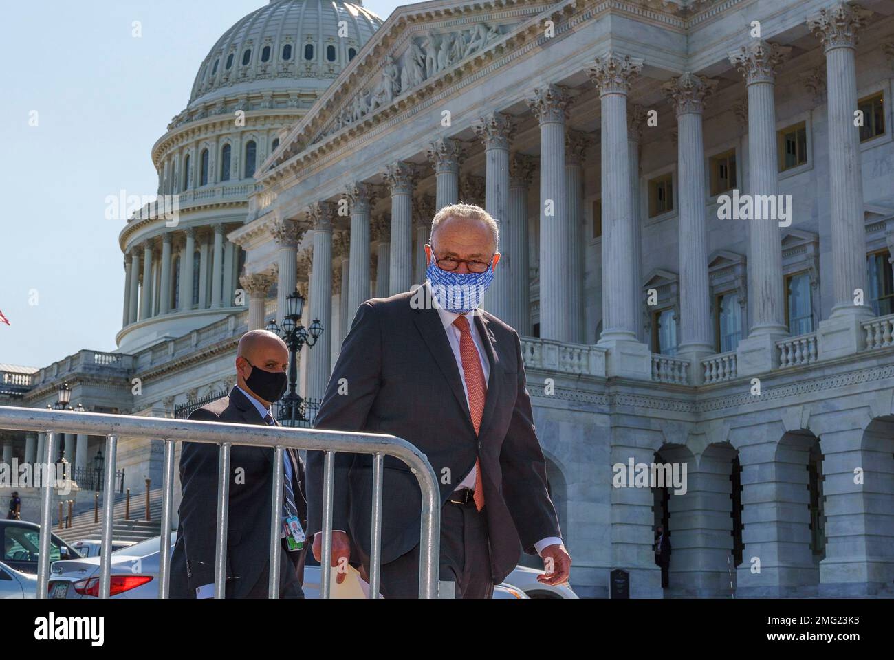 Senate Minority Leader Chuck Schumer, D-N.Y., walks to a press briefing ...