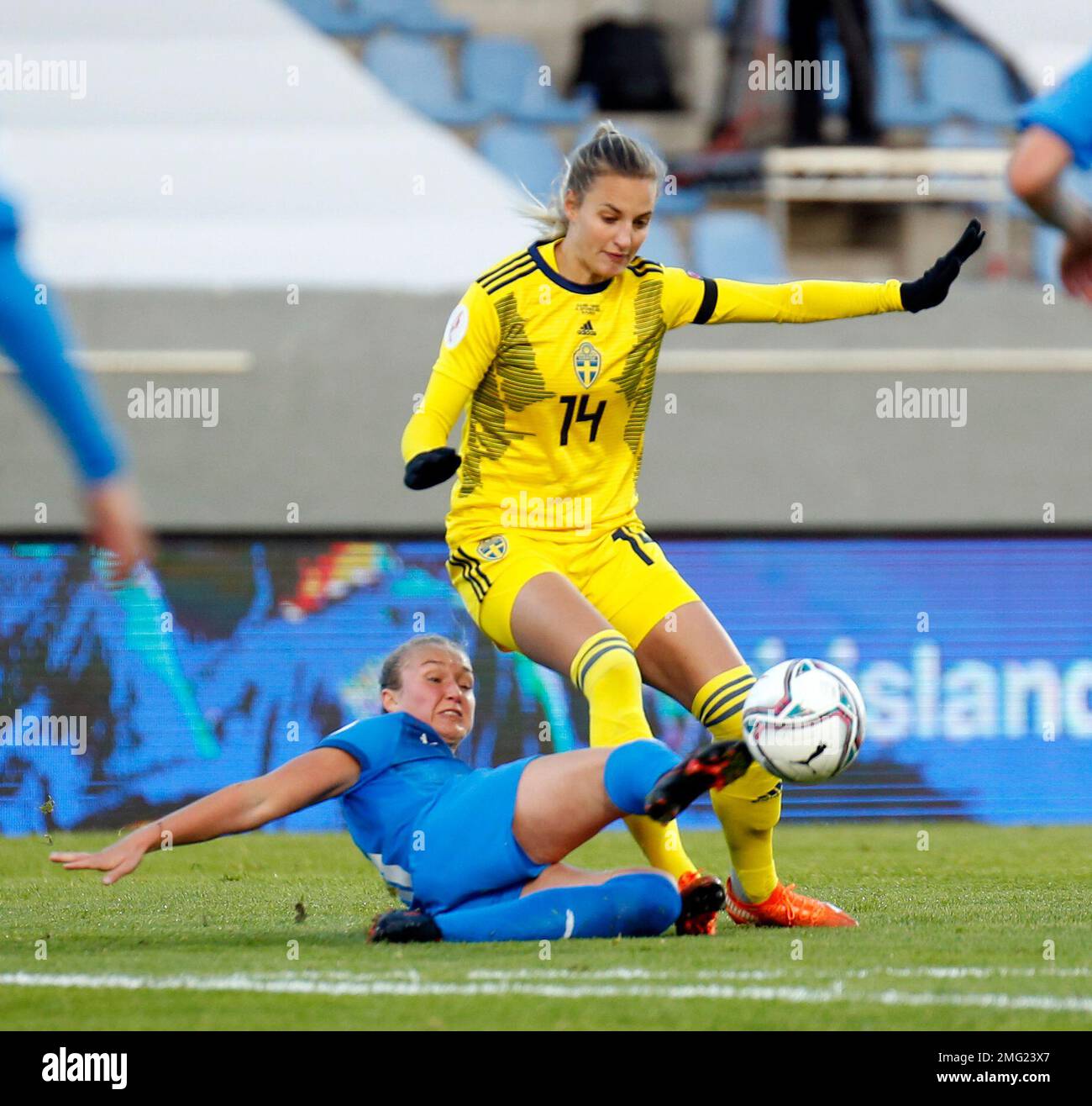 Iceland's Sveindis Jane Jonsdottir, left, challenges Sweden's Nathalie ...