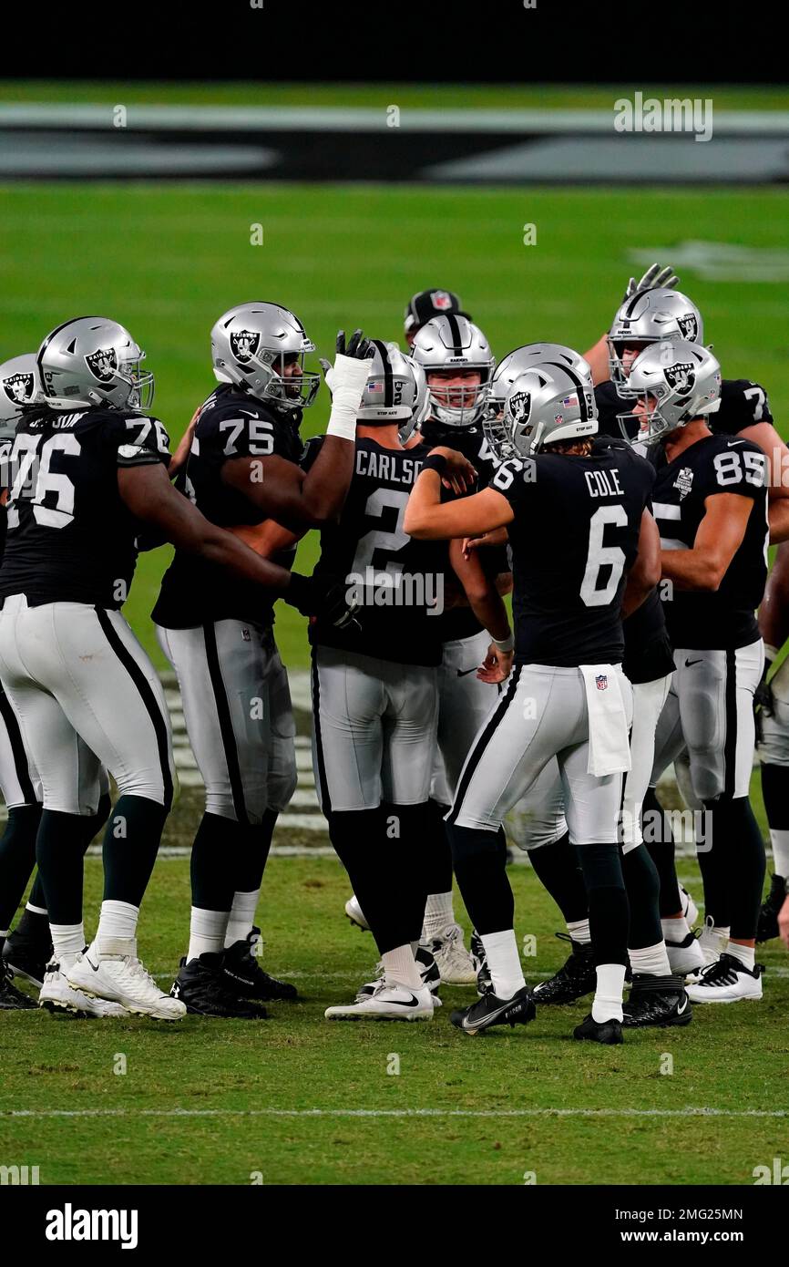 Las Vegas Raiders players celebrate after kicker Daniel Carlson (2 ...