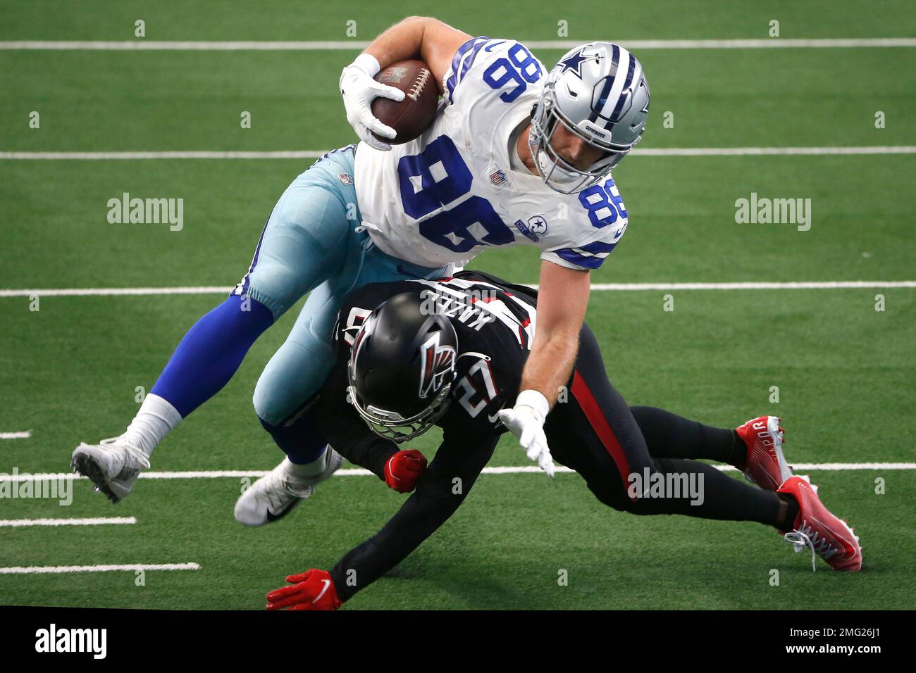 Dallas Cowboys tight end Dalton Schultz (86) is hit by Atlanta Falcons ...