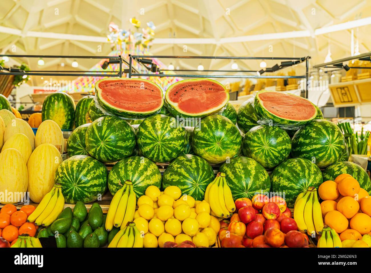 Assortment of fresh organic fruits and vegetables on market shelves ...