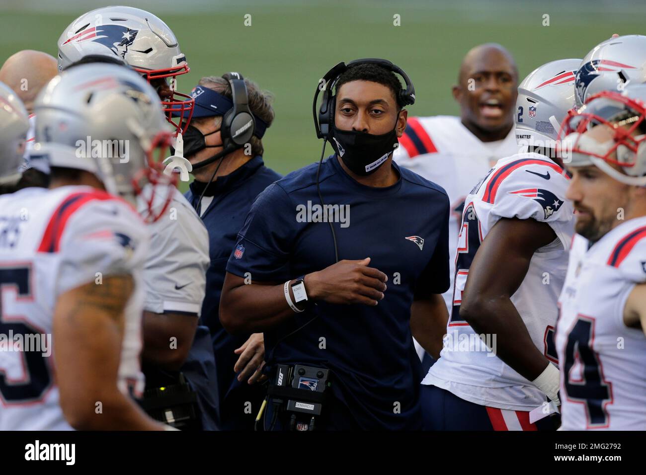 New England Patriots defensive line coach DeMarcus Covington wears a ...