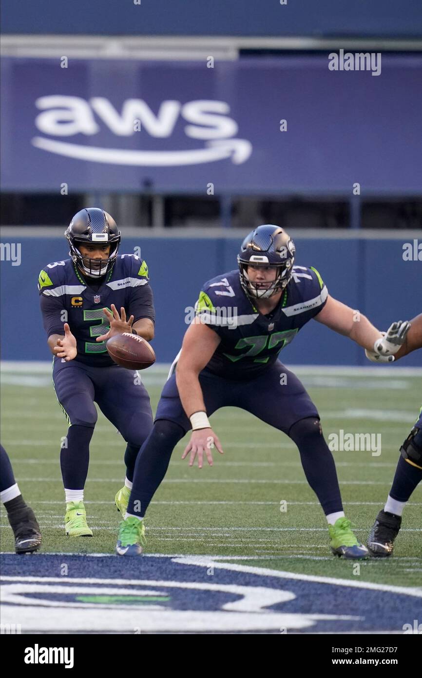 Seattle Seahawks quarterback Russell Wilson takes a snap from center ...