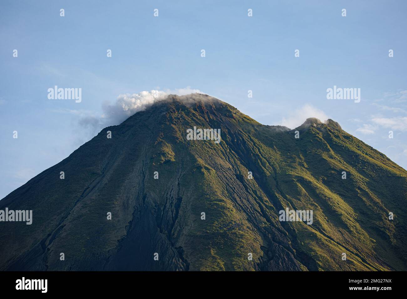 Steam rising from Arenal Volcano an active andesitic stratovolcano ...