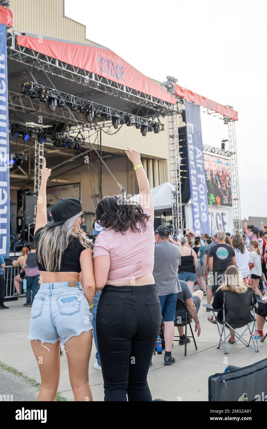 Audience members dance to a song played by the rock band We the Kings ...