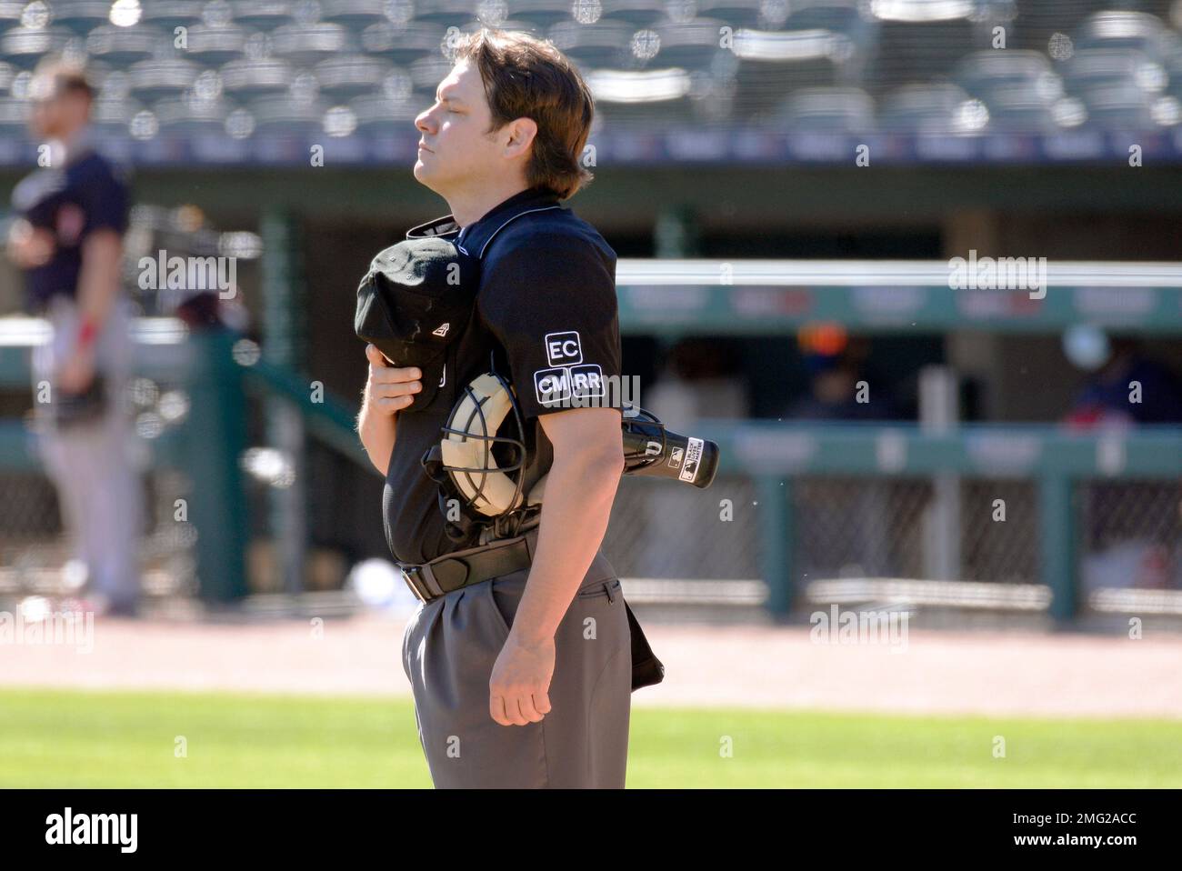 Home plate umpire D.J. Reyburn stands for the singing of God Bless ...
