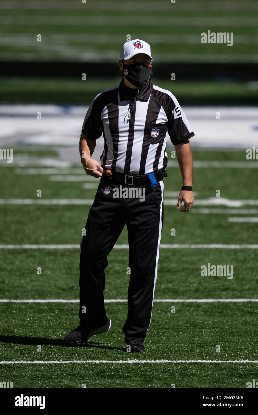 NFL referee Alex Kemp (55) walks across the field during an NFL ...