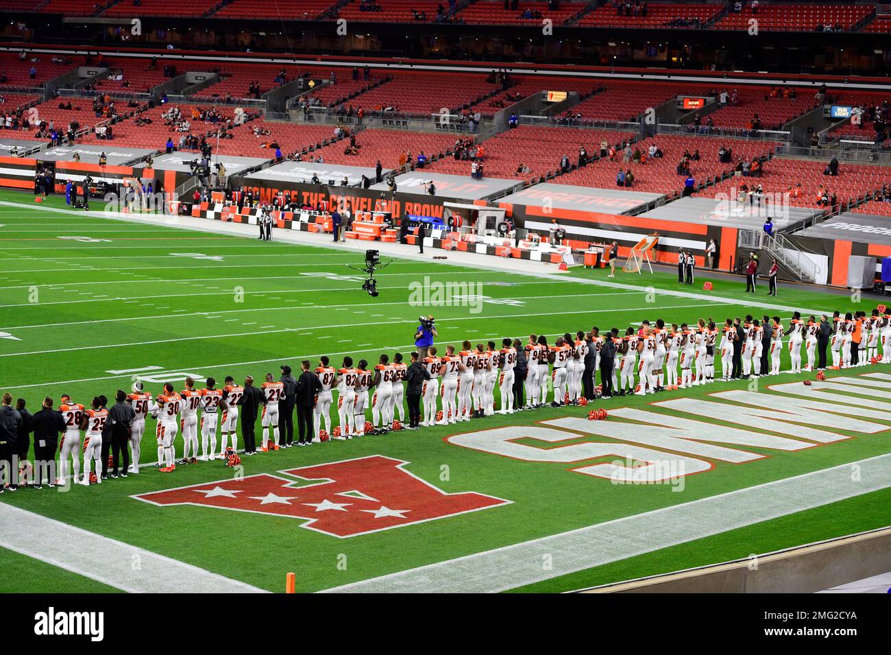 Players from the Cincinnati Bengals lock arms during a pregame ceremony ...