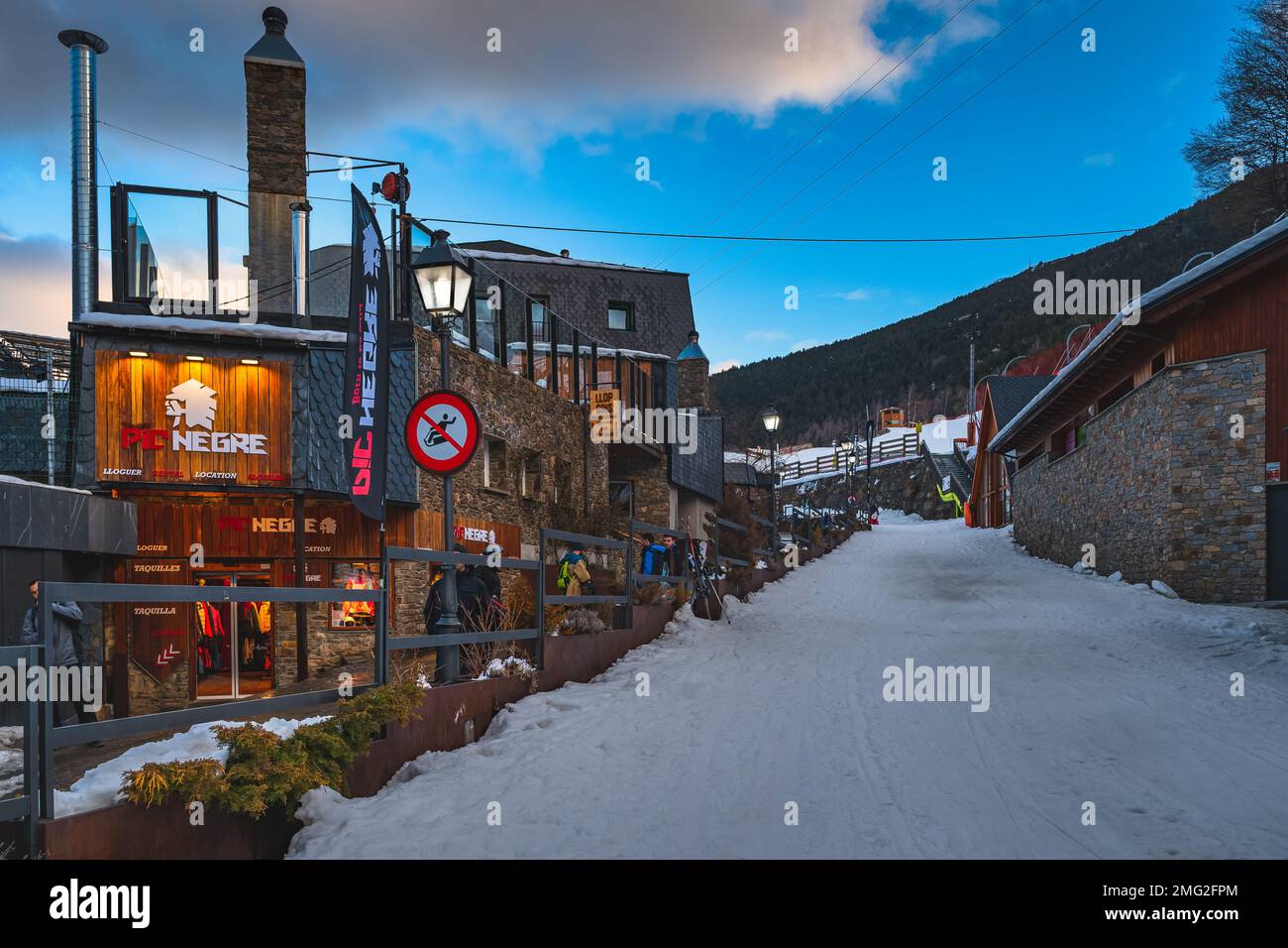 El Tarter, Andorra, Jan 2020 Street lights illuminating shops, bars ...