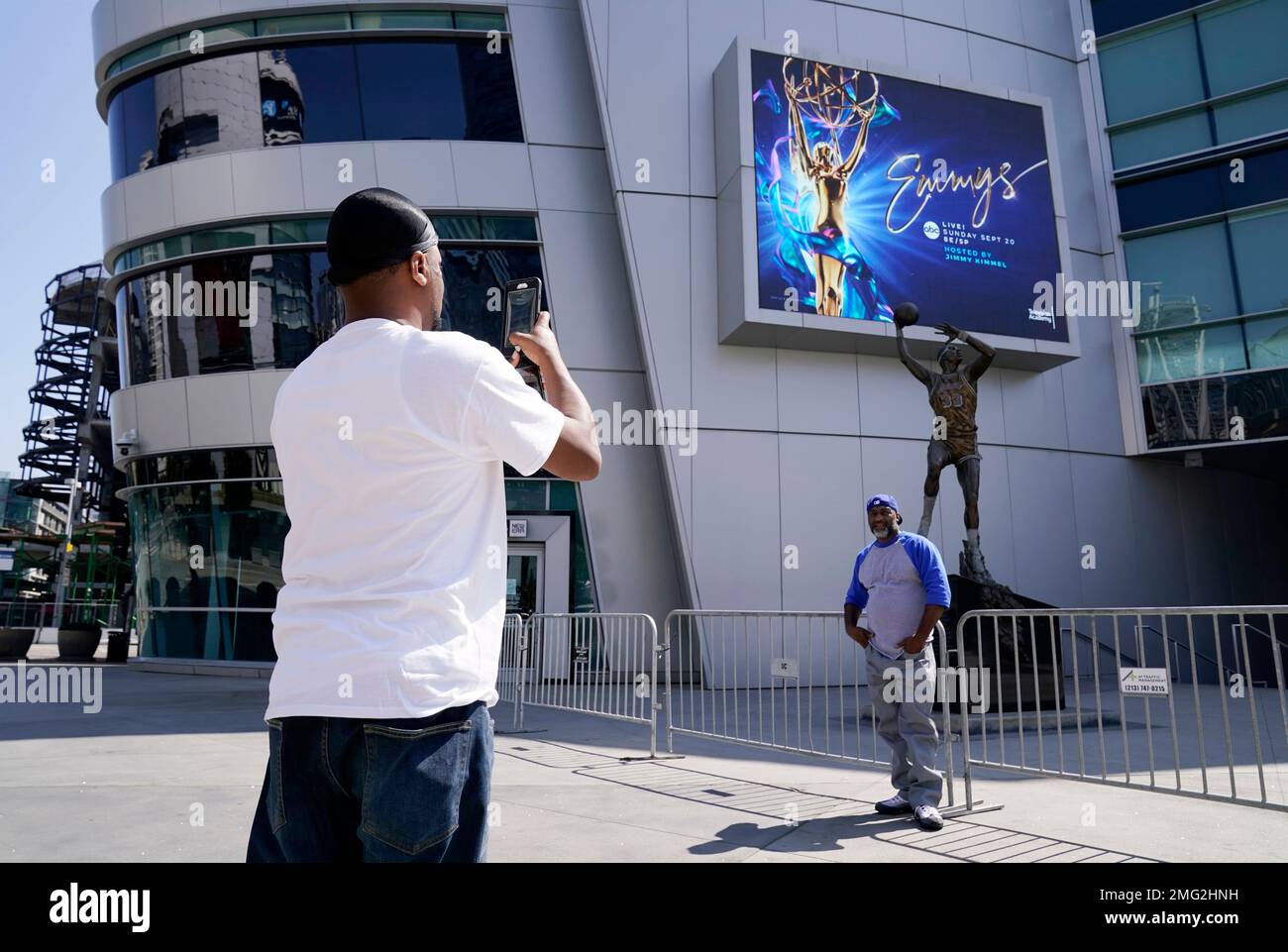 Michael Black, left, takes a picture of his friend Kenneth Jones ...