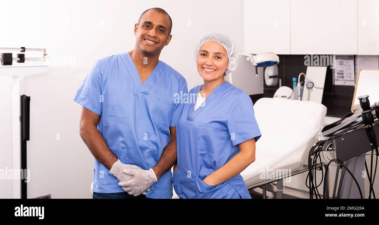 Smiling female and male cosmetologists in medical center Stock Photo ...