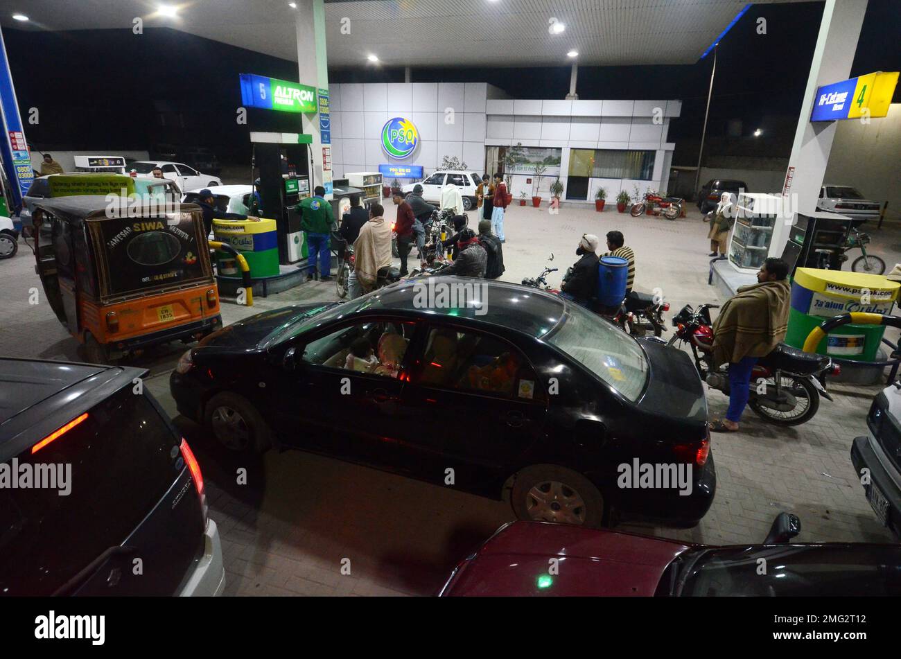 People wait for their turn to get fuel at a petrol station, a day after a country-wide power ...
