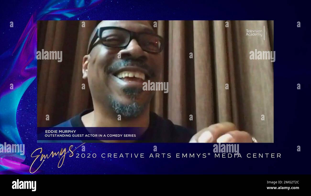 Eddie Murphy accepts the Emmy for Outstanding Guest Actor In A Comedy ...