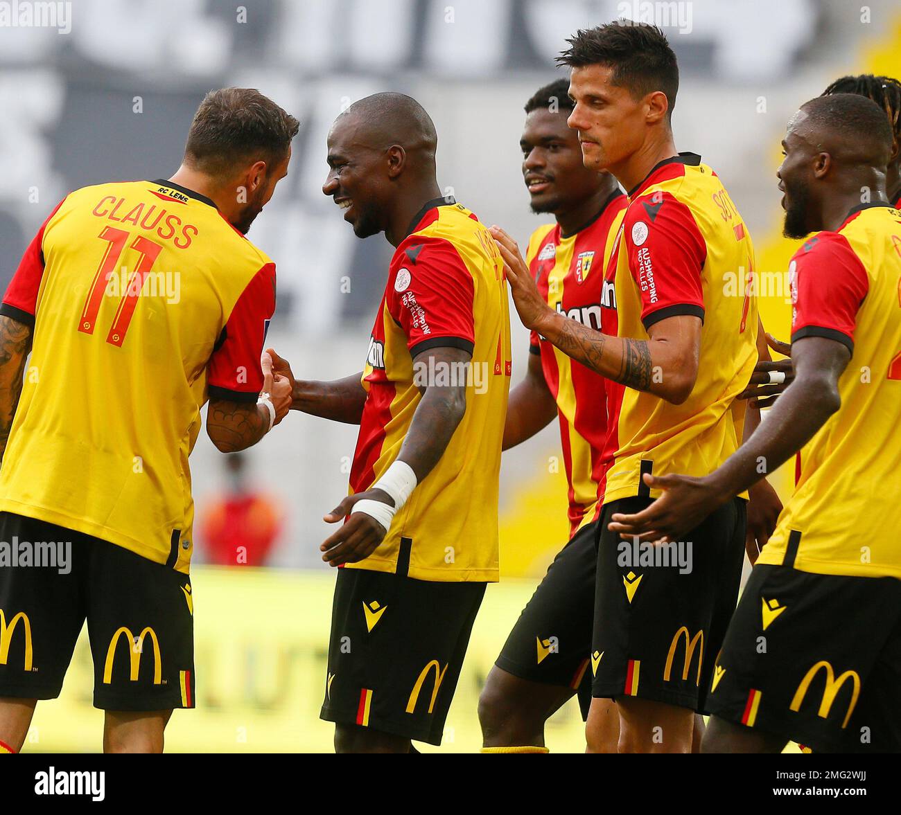Lens players react after scoring during the French League One soccer ...