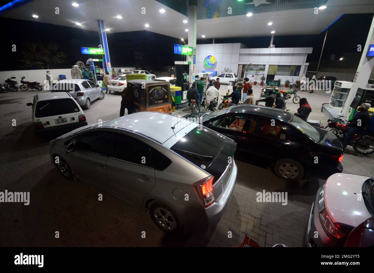 People wait for their turn to get fuel at a petrol station, a day after a country-wide power ...