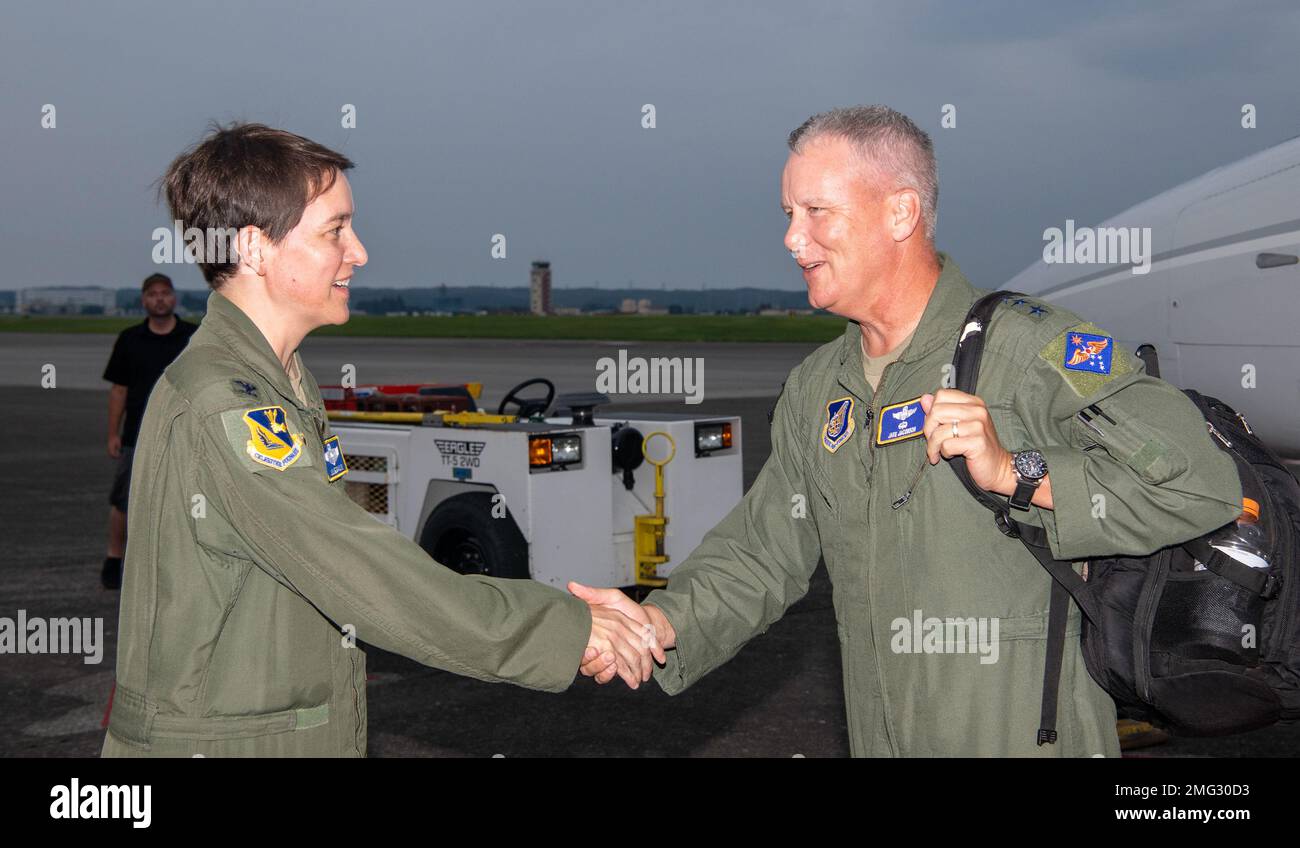 Col. Julie Gaulin, 374th Airlift Wing vice commander, shakes hands with ...
