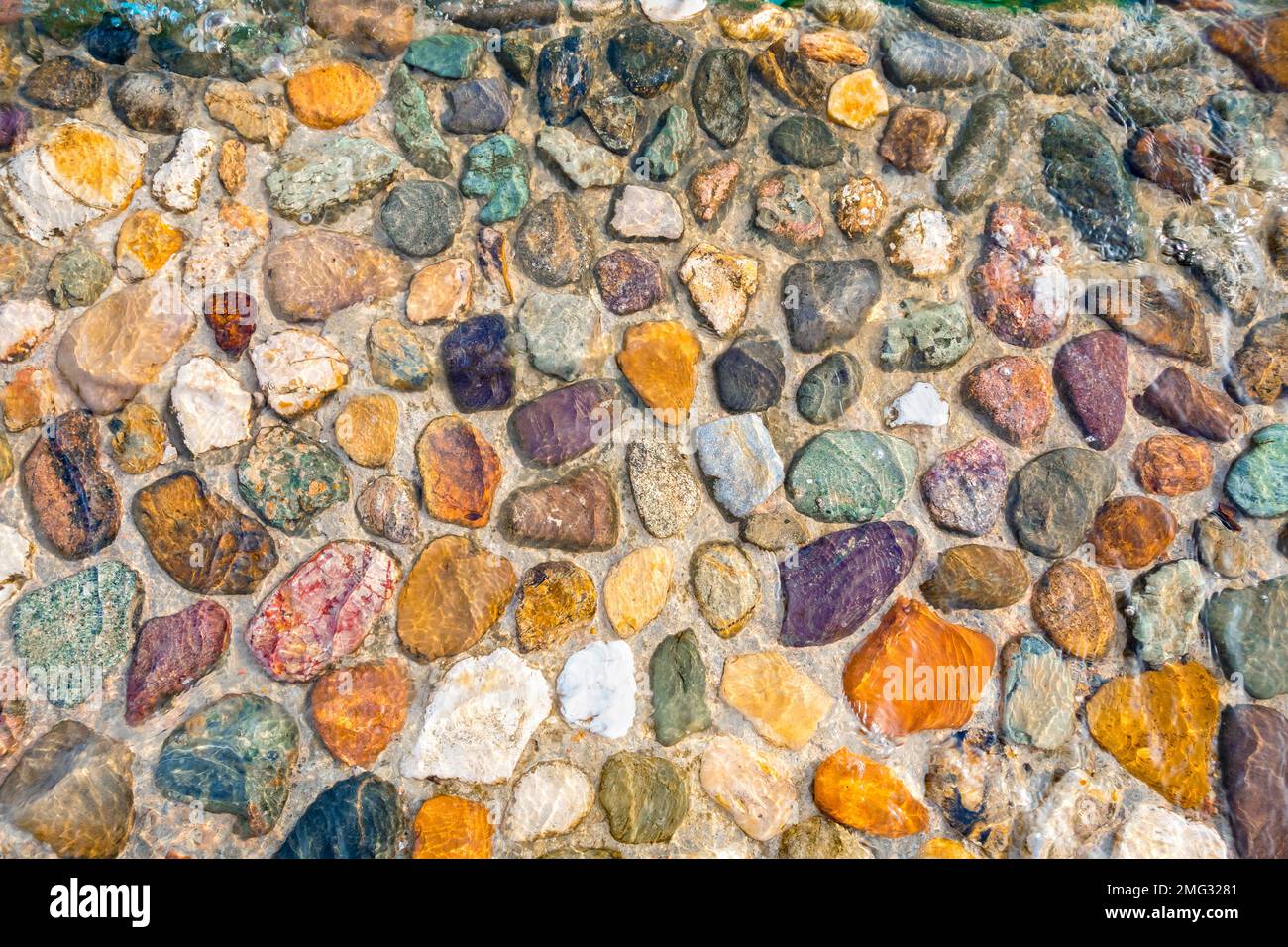 The colorful beautiful stones are washed by water. Background Stock ...
